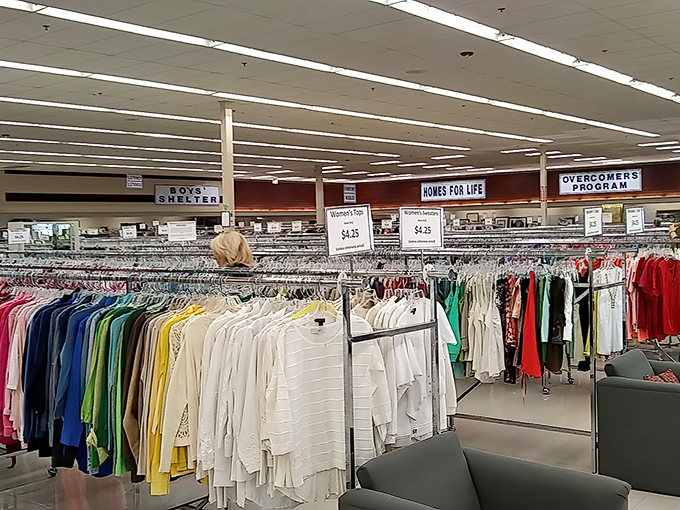 Color-coded clothing racks stretch as far as the eye can see, organized with a precision that would make Marie Kondo weep with joy.