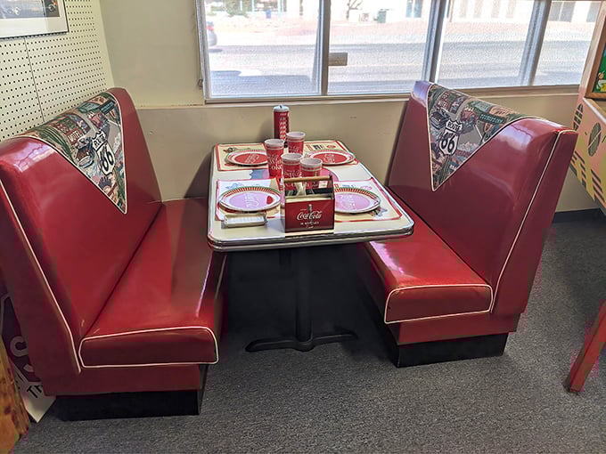 This cherry-red diner booth isn't just furniture—it's a time machine. One Coca-Cola and suddenly it's 1955 all over again.