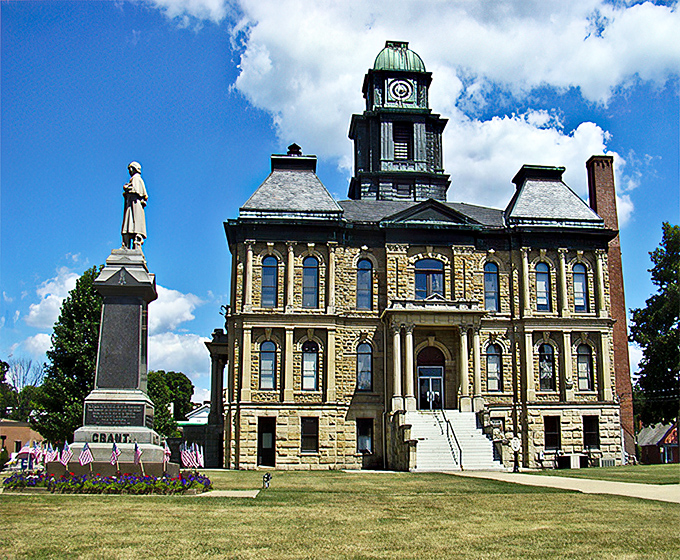 The magnificent Holmes County Courthouse stands like a Victorian sentinel, its limestone facade having witnessed generations of Amish buggies clip-clopping past.