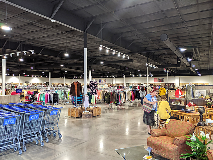 Endless racks stretch toward the horizon in this thrifter's paradise. The sheer scale makes big-box stores look like corner shops.