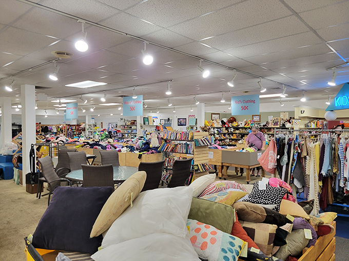 A sea of possibilities awaits inside – where cushions form their own mountain range and clothing racks stretch toward retail nirvana. 