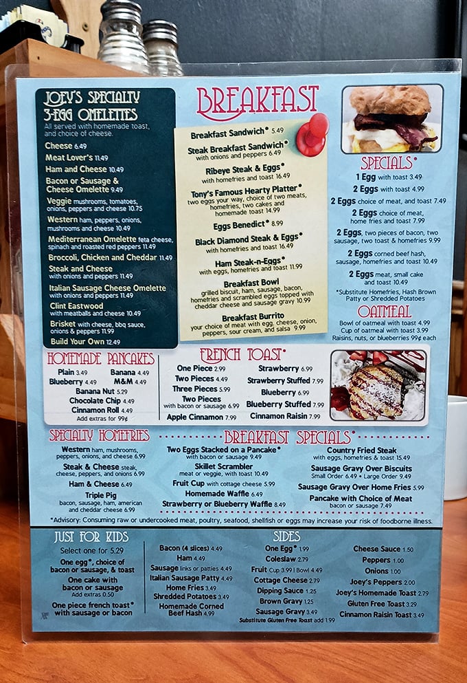 Breakfast heaven unfolds on laminated pages. Joey's specialty omelets and homemade pancakes aren't just menu items—they're morning salvation for hungry travelers.