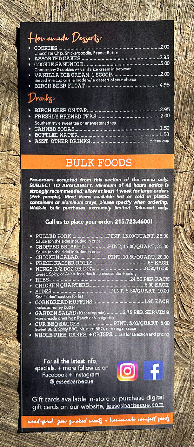 A menu that doesn't need fancy fonts or flowery descriptions—just the straightforward promise of wood-fired, slow-smoked meats and homemade comfort.