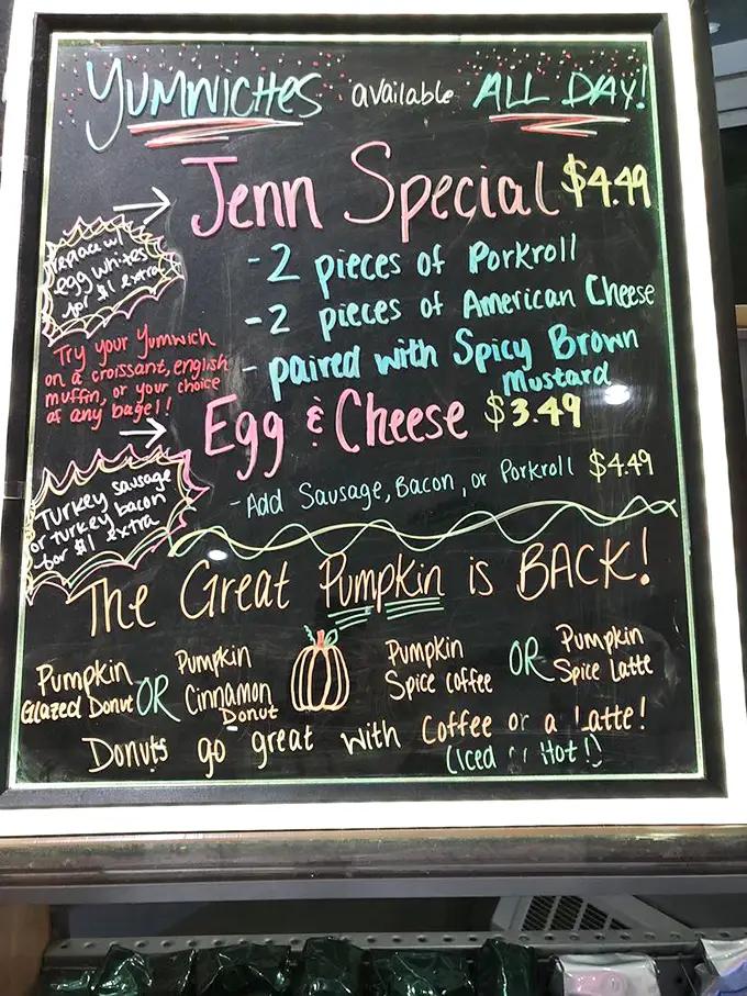 The chalkboard menu promises seasonal treasures. "The Great Pumpkin is BACK!" isn't just a Charlie Brown reference—it's cause for celebration among donut aficionados.
