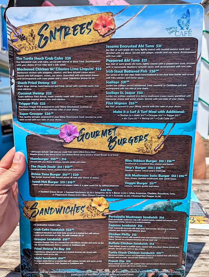 A menu that reads like a love letter to seafood lovers. The coconut shrimp is calling your name—can you hear it?