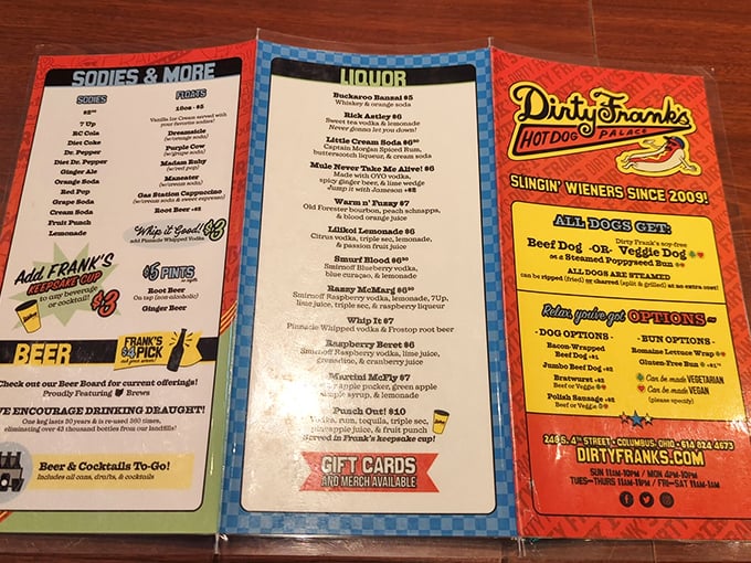 The menu reads like a novelist's fever dream—each hot dog creation more audacious than the last, with cocktails named after cultural icons.