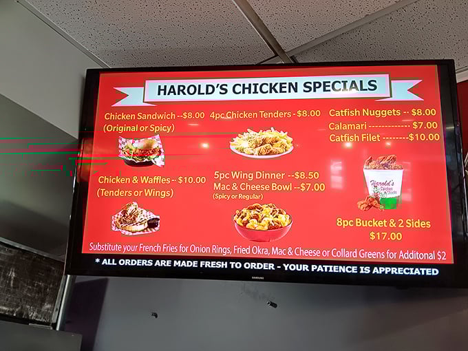 The menu board tells a simple story: chicken is king, but don't sleep on those catfish nuggets or the legendary chicken and waffles combo.