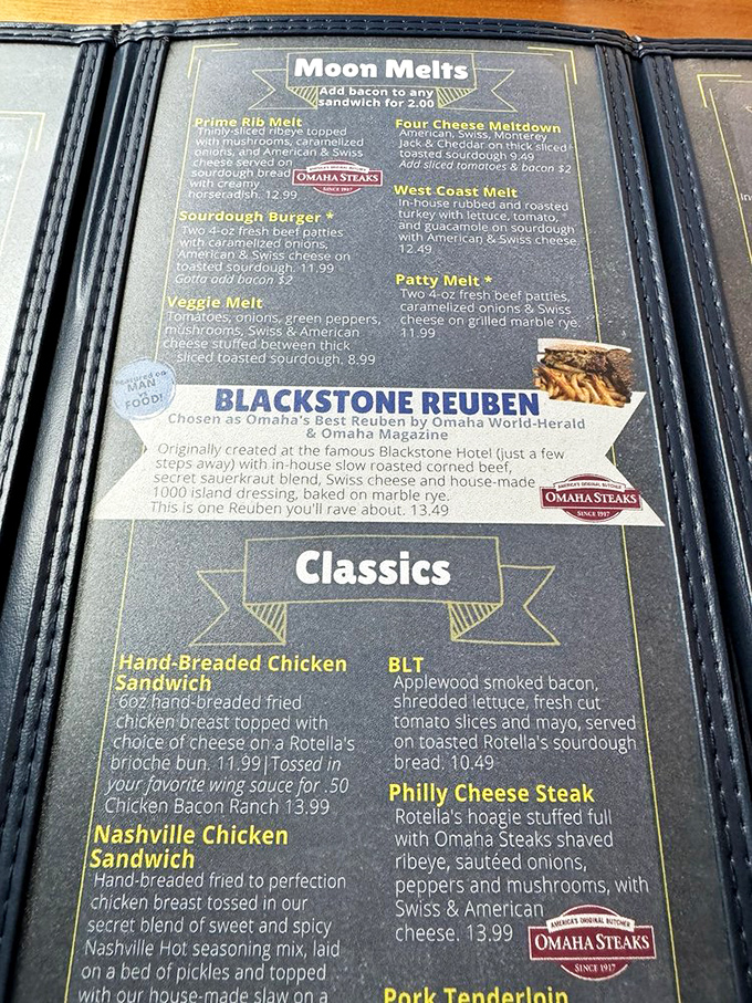 The menu tells the origin story like a superhero's biography—this Reuben was born at the Blackstone Hotel and perfected here.