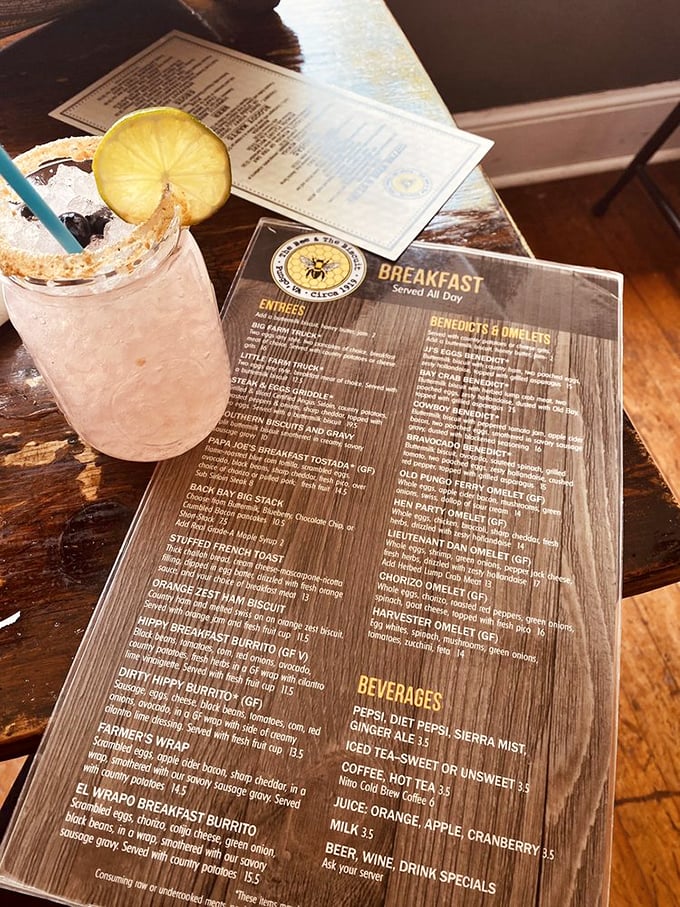 A pink cocktail and wooden menu board—breakfast served all day is music to the ears of anyone who's ever craved pancakes at 3pm.