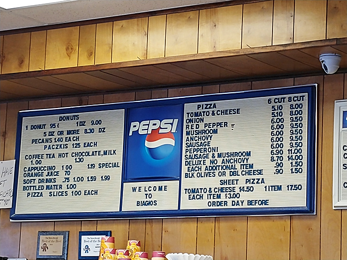 The menu board at Biagio's hasn't changed in decades—a refreshing time capsule where prices still seem reasonable and "WELCOME TO BIAGIO'S" feels genuine.