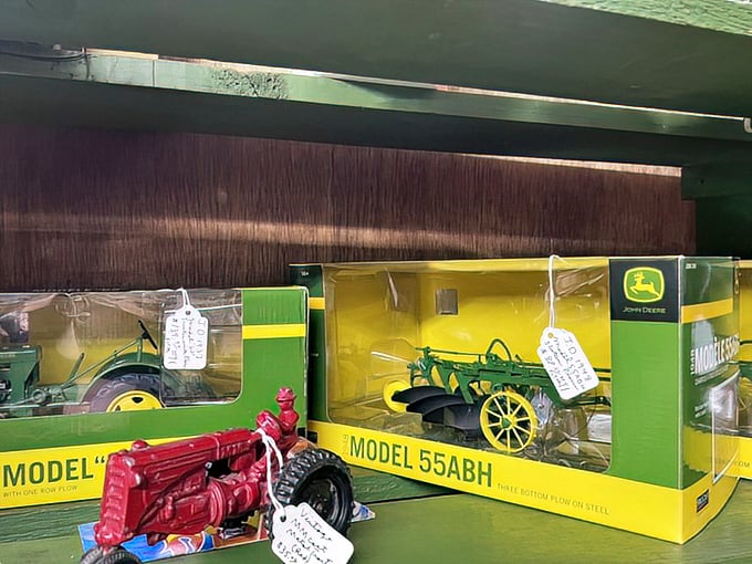 These miniature John Deere tractors aren't just toys—they're childhood memories for farmers who once dreamed of driving the real thing. Green and yellow nostalgia, boxed and waiting.