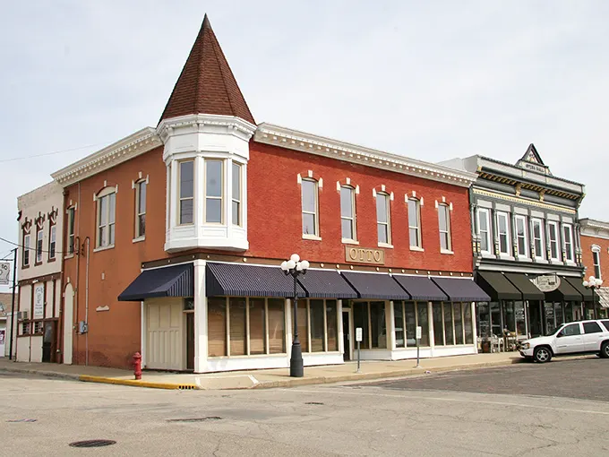 This corner building with its distinctive turret stands as a Victorian-era reminder that architecture once had personality to spare.