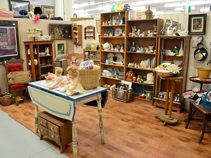 Every shelf tells a story in this carefully curated booth. That blue-trimmed table has probably hosted more tea parties than the Mad Hatter.