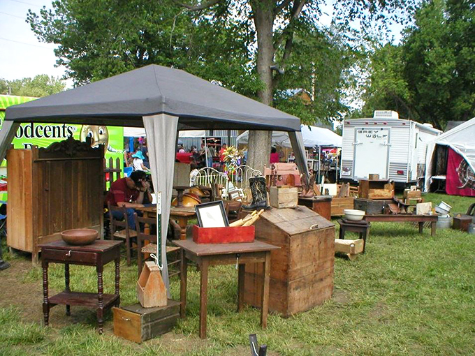 Rustic wooden furniture under canvas canopies—where farmhouse chic was a thing long before HGTV convinced suburban America it needed more shiplap.