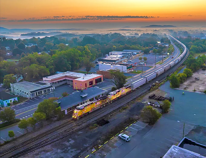 Morning mist blankets Crozet like nature's own cotton candy, while trains rumble through town—a daily reminder of the railroad heritage that birthed this mountain gem.