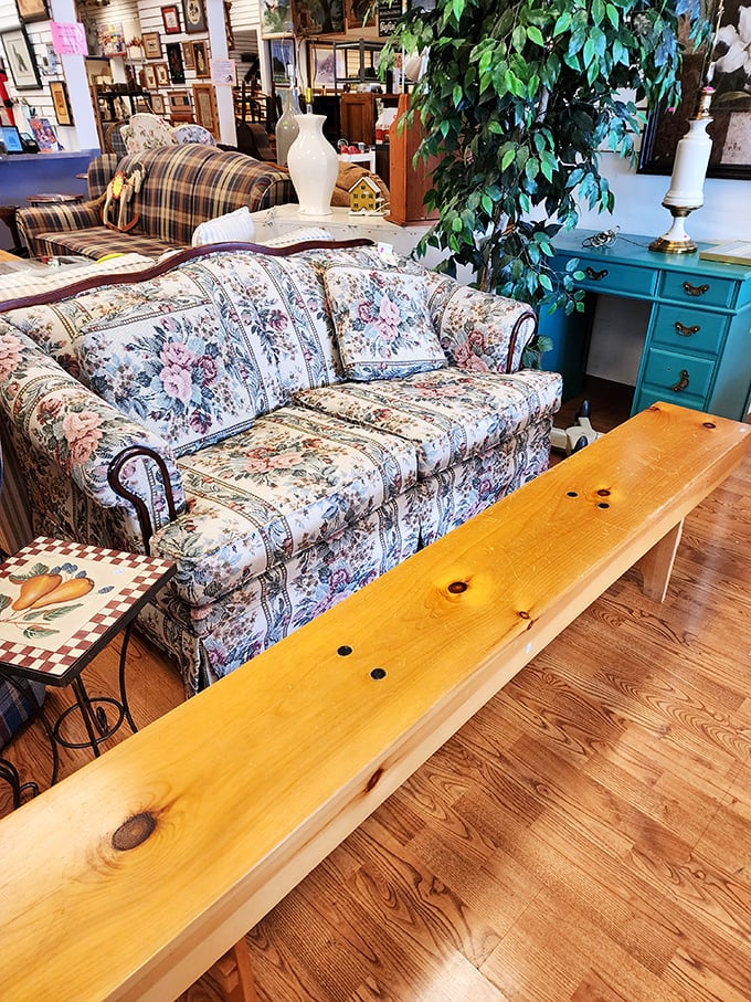 That floral sofa has stories to tell, while the turquoise desk behind it is begging for a second act in someone's home office.
