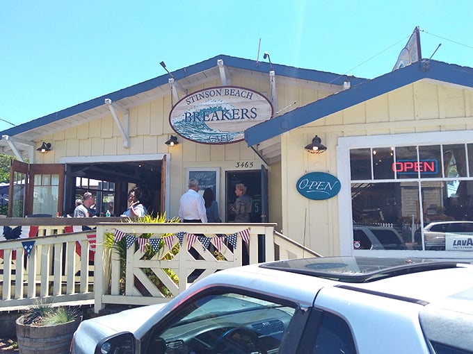 Breakers Café welcomes hungry beachgoers with its cheerful yellow facade and promise of post-swim sustenance that'll make you forget your sunburn.