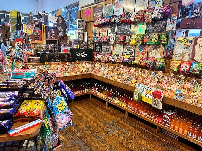 Wooden bins overflow with colorful candies while vintage tin signs cover the walls—a museum of American confectionery where everything is for sale and touching is encouraged.