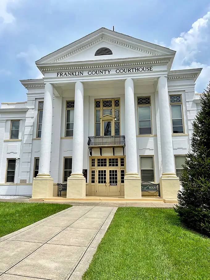 The Franklin County Courthouse stands proud with its gleaming white columns, a stately anchor in this Blue Ridge town.