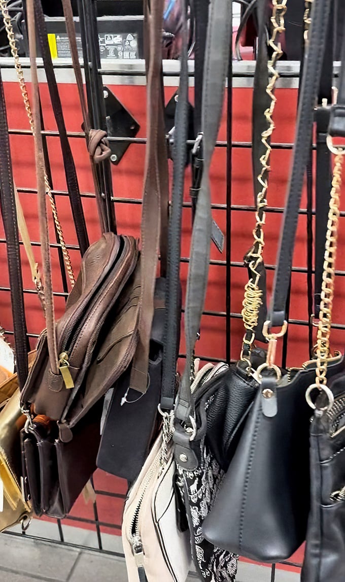 A leather handbag jungle where designer dreams and budget realities peacefully coexist on the same metal grid.