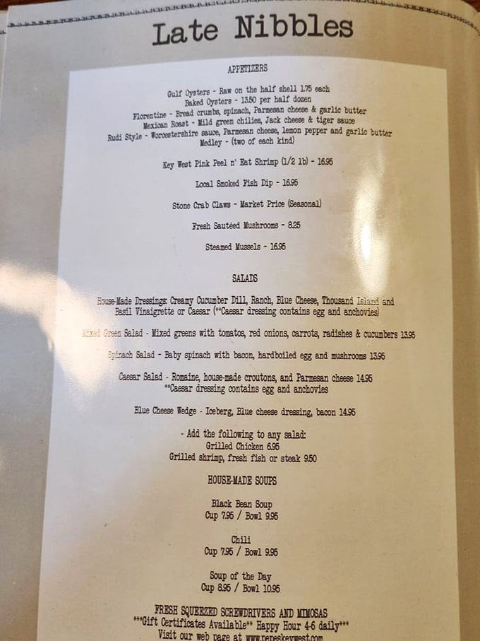 The "Late Nibbles" menu reads like a love letter to seafood lovers—Gulf oysters, pink shrimp, and stone crab claws stealing the spotlight.