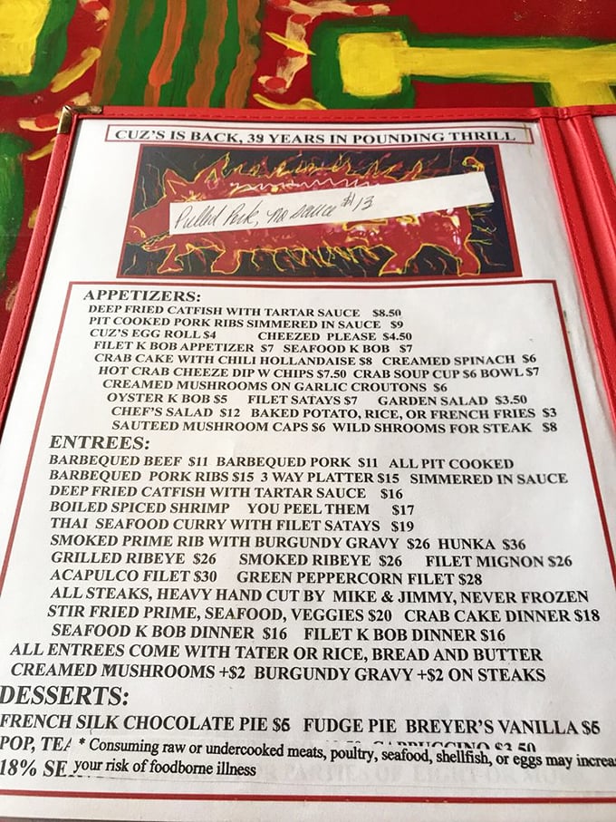 This menu tells the real story – hand-cut steaks, seafood that requires work ("YOU PEEL THEM"), and desserts worth saving room for.