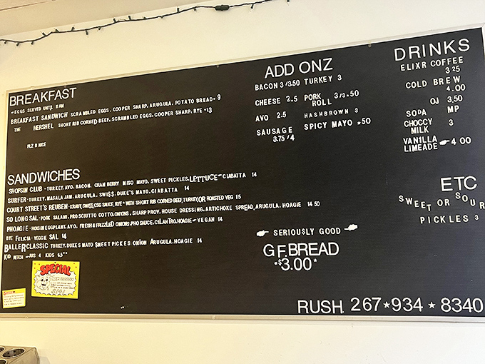 This menu board isn't just a list—it's a roadmap to happiness. Each sandwich name promises a story, each description a culinary adventure waiting to happen.