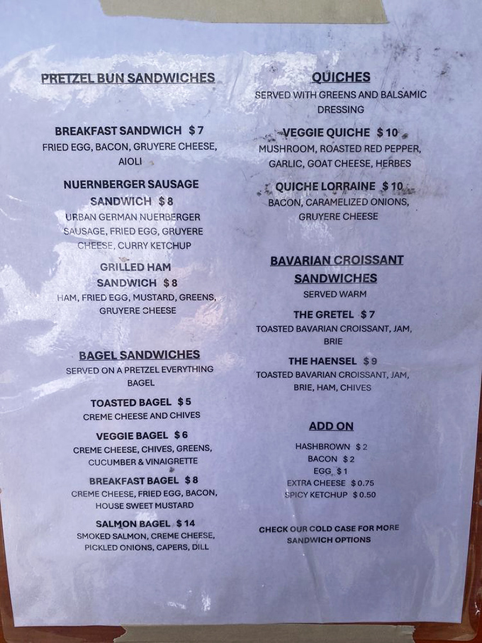 The menu reads like a love letter to German-inspired comfort food. Pretzel bun sandwiches and quiches? Jawohl, mein freund!