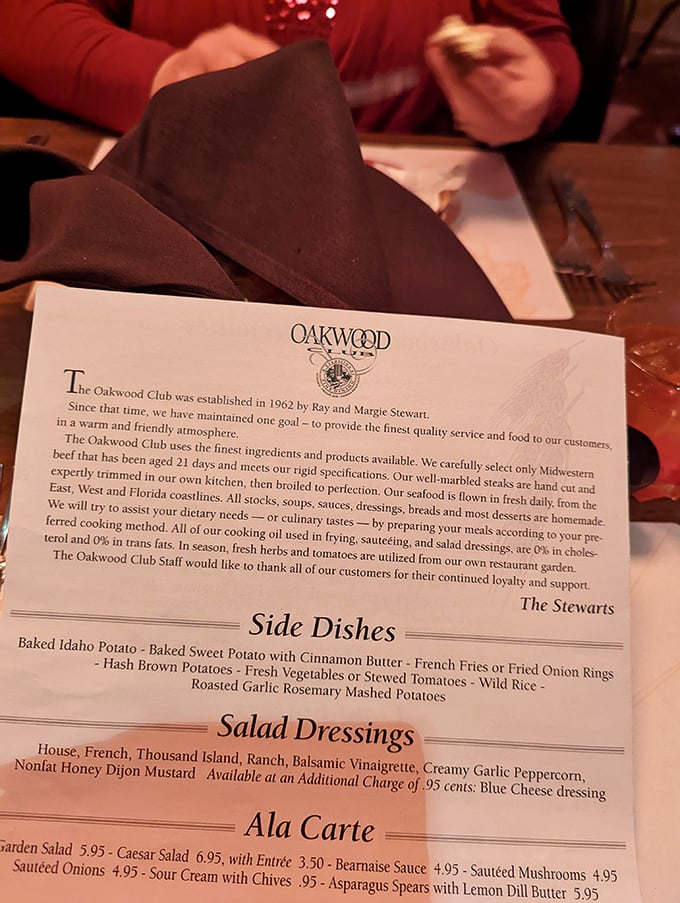 The menu tells the story—Midwestern beef aged 21 days, hand-cut steaks, and homemade desserts. Reading it feels like getting a love letter to carnivores.