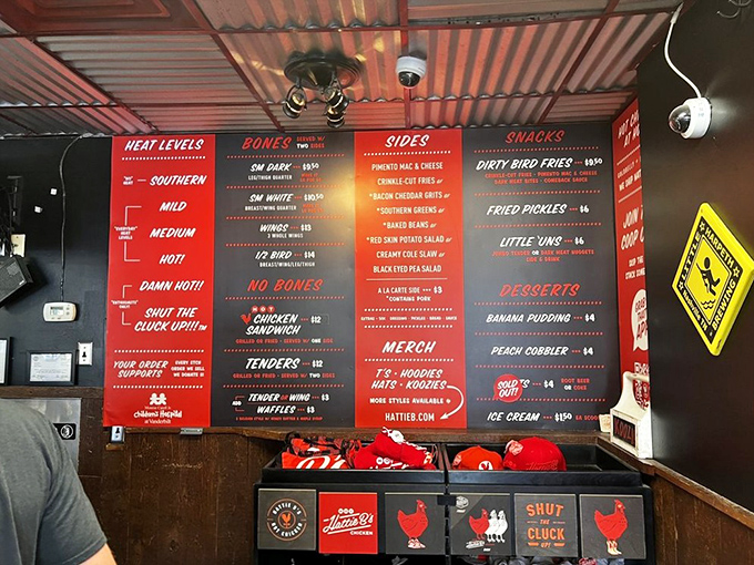 The menu board reads like a heat index warning system. "Shut the Cluck Up!!!" isn't just clever wordplay—it's a dare wrapped in cayenne.