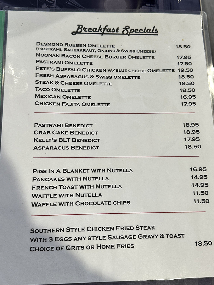 This menu reads like a love letter to breakfast indulgence. The Desmond Reuben Omelette and "Pigs in a Blanket with Nutella" prove someone's grandmother is clearly running the kitchen.