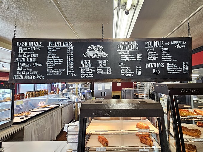 The chalkboard menu reads like poetry to pretzel lovers—classic twists, wraps, and sandwiches that transform simple dough into edible art.