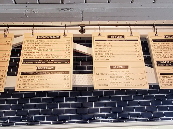 The menu board tells the whole delicious story—Lake Erie's bounty transformed into golden-fried perfection awaits your order.