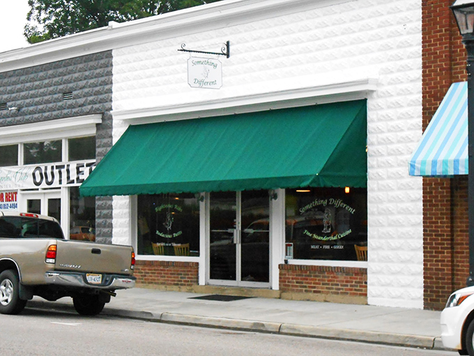 "Something Different" indeed – this charming storefront promises exactly what small-town America delivers best: an experience you won't find in any mall or chain store.