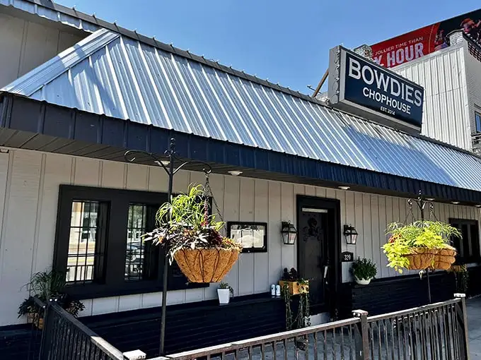 Bowdie's blue-trimmed exterior with hanging plants says "we care about details"—just wait till you see what they do with a ribeye!