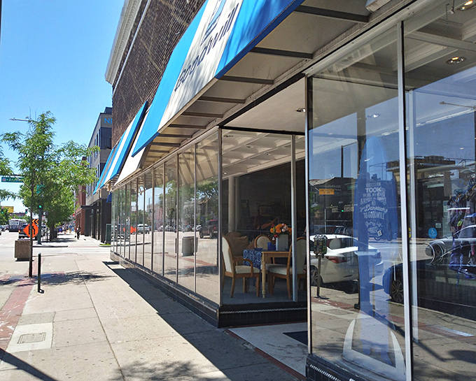 Goodwill's Broadway location stands proud with its classic brick exterior and inviting blue awnings – a Denver thrifting institution.