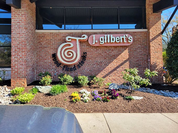 J. Gilbert's curb appeal is just the appetizer—the main course of wood-fired perfection awaits inside those brick walls.