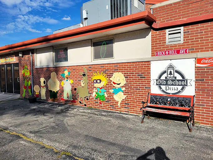 Old School Pizza's playful exterior murals hint at the nostalgic joy waiting inside—along with seriously good pies.