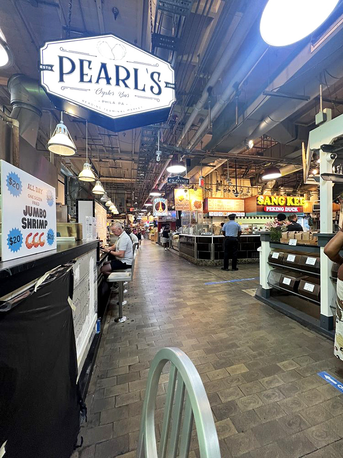 Pearl's bustling counter in Reading Terminal Market—where oyster shucking becomes performance art and lunch becomes an event.