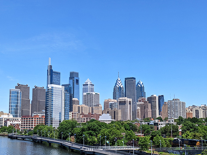 Philadelphia's modern skyline stretches toward the clouds, a glittering testament to the city that shaped America. Rocky would approve of this view!