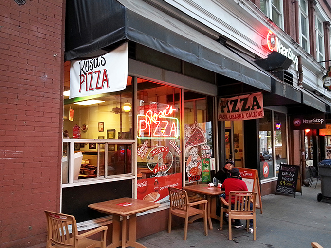 Rosa's neon sign glows like a pizza lighthouse in downtown Atlanta, beckoning hungry souls with promises of New York-style perfection.