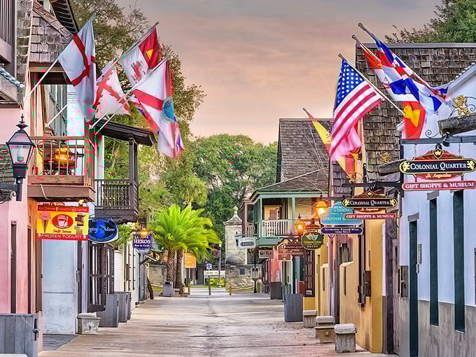 St. Augustine's Colonial Quarter at sunset, when the flags flutter and history whispers through the cobblestone streets.
