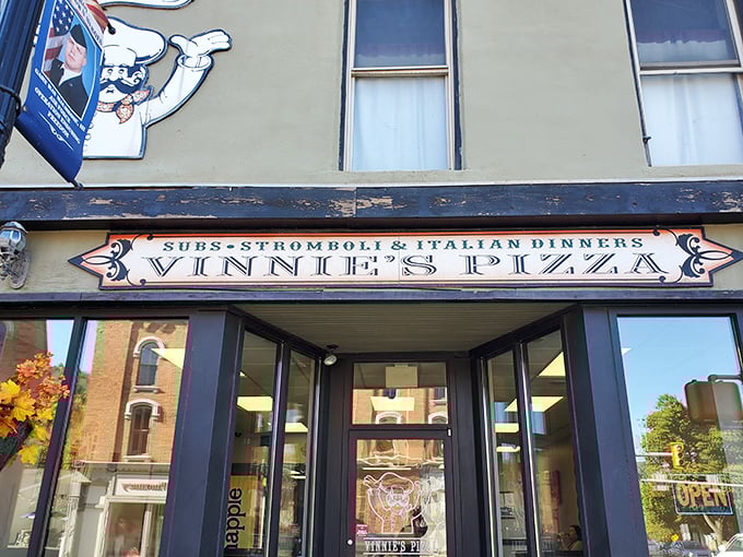 Vinnie's charming vintage sign promises three Italian food groups – subs, stromboli, and dinner. But the pizza steals the show!