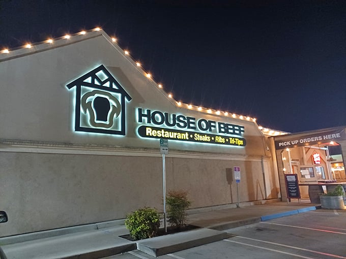 Night falls, but House of Beef's sign shines bright – promising tri-tip treasures to those wise enough to stop.