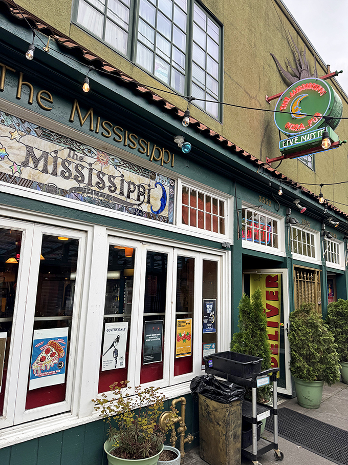 That mosaic sign isn't just decoration – it's a colorful preview of the creative pizza artistry waiting inside.