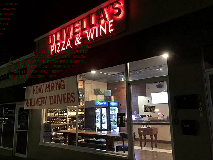 Olivella's Pizza and Wine: "Neon signs and pizza dreams. Small in size but mighty in flavor – just like the best Italian nonnas!"