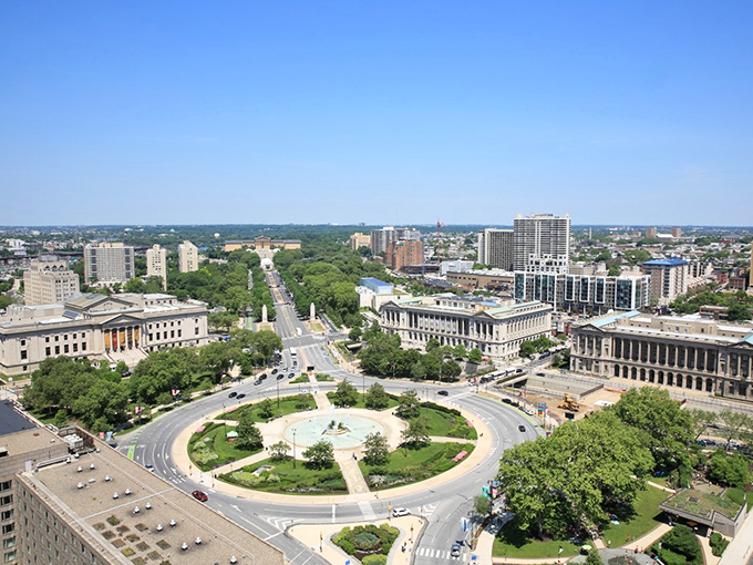 Philly's Benjamin Franklin Parkway creates a green path through the city, leading to cultural treasures. Like the Champs-Élysées with cheesesteaks nearby!