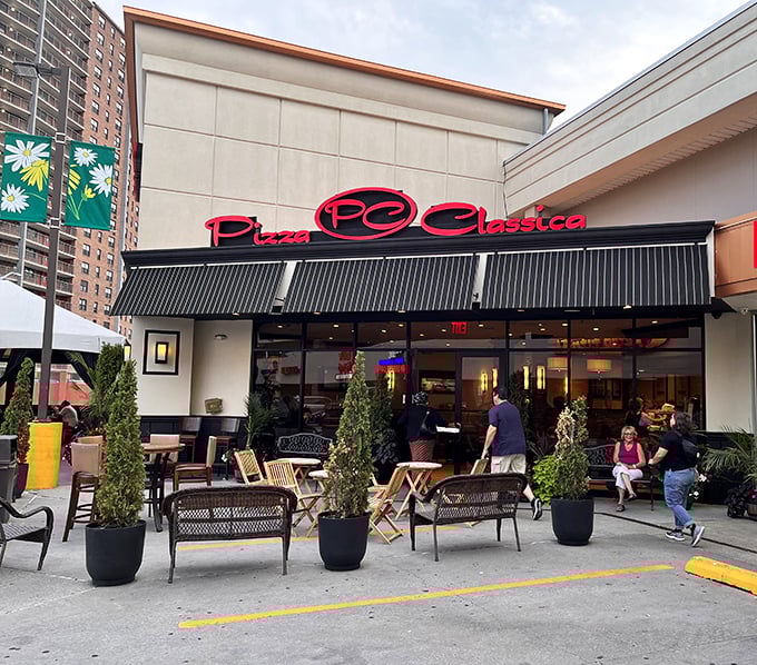 The outdoor seating at Pizza Classica invites you to people-watch while sauce dribbles happily down your chin.