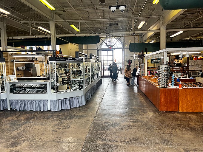 Jewelry displays glitter under fluorescent lights at Raleigh Flea Market. One person's downsized collection becomes another's fashion statement!