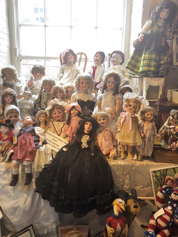 An army of antique dolls stands in eerie formation, their porcelain faces frozen in time—childhood treasures or tonight's nightmare fuel? You decide.